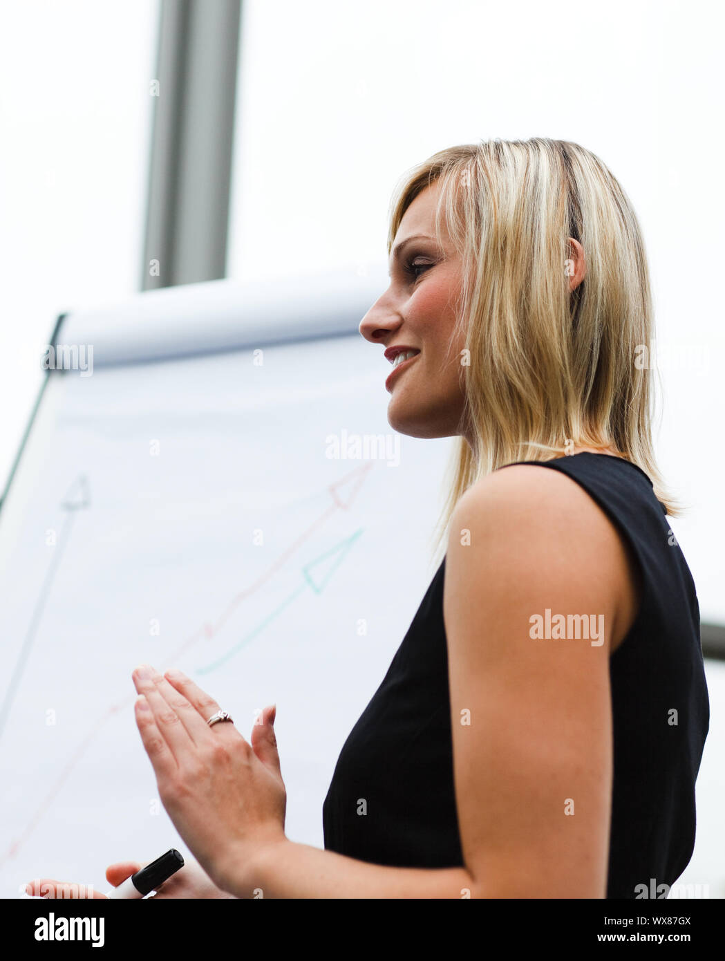 Beautiful businesswoman clapping after giving a presentation Stock ...