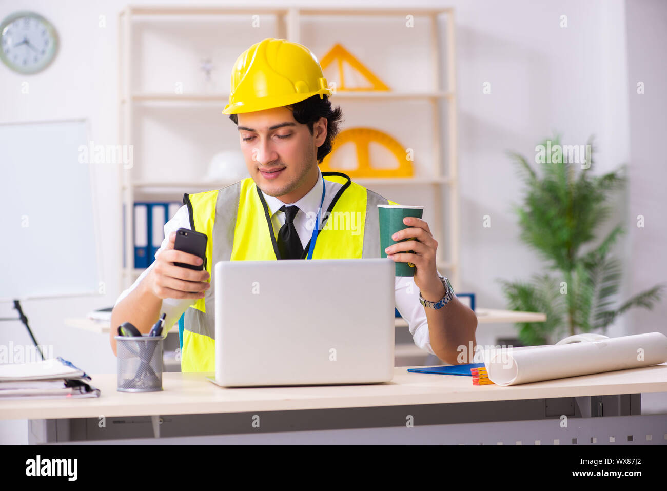 Male construction engineer working in the office Stock Photo - Alamy
