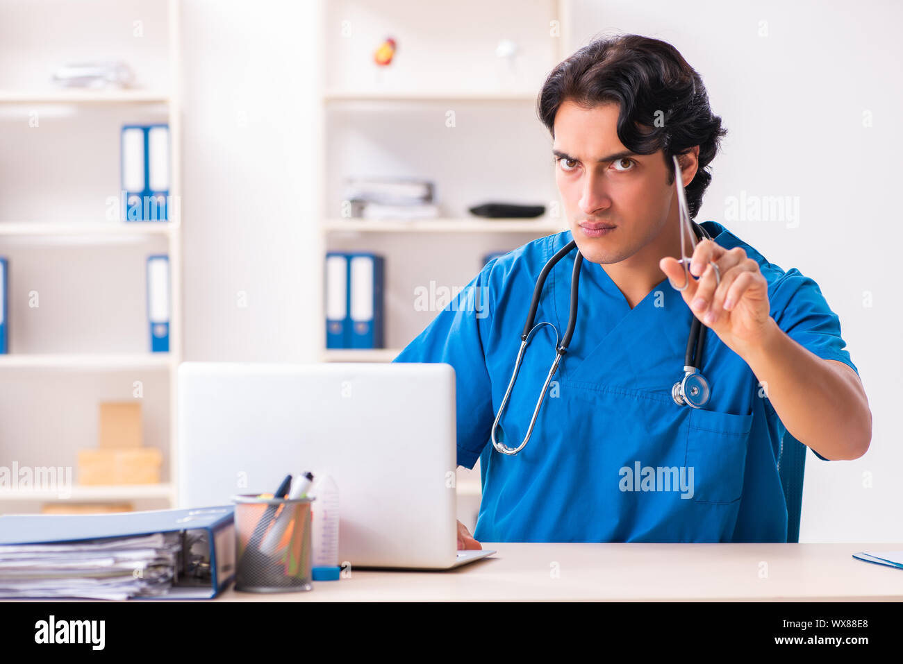 Handsome doctor surgical scissors hi-res stock photography and images ...