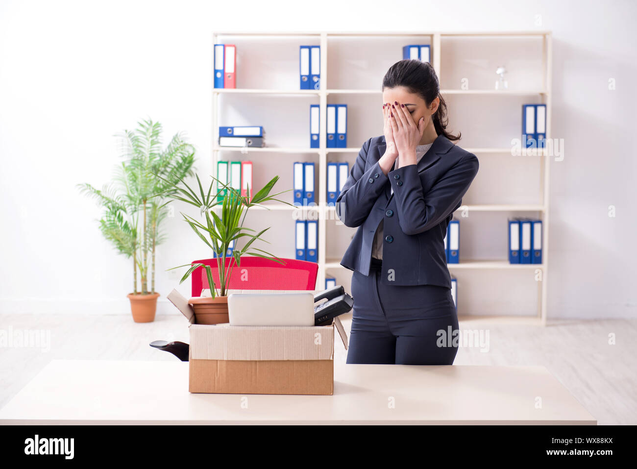 Young female employee being fired from her work Stock Photo - Alamy