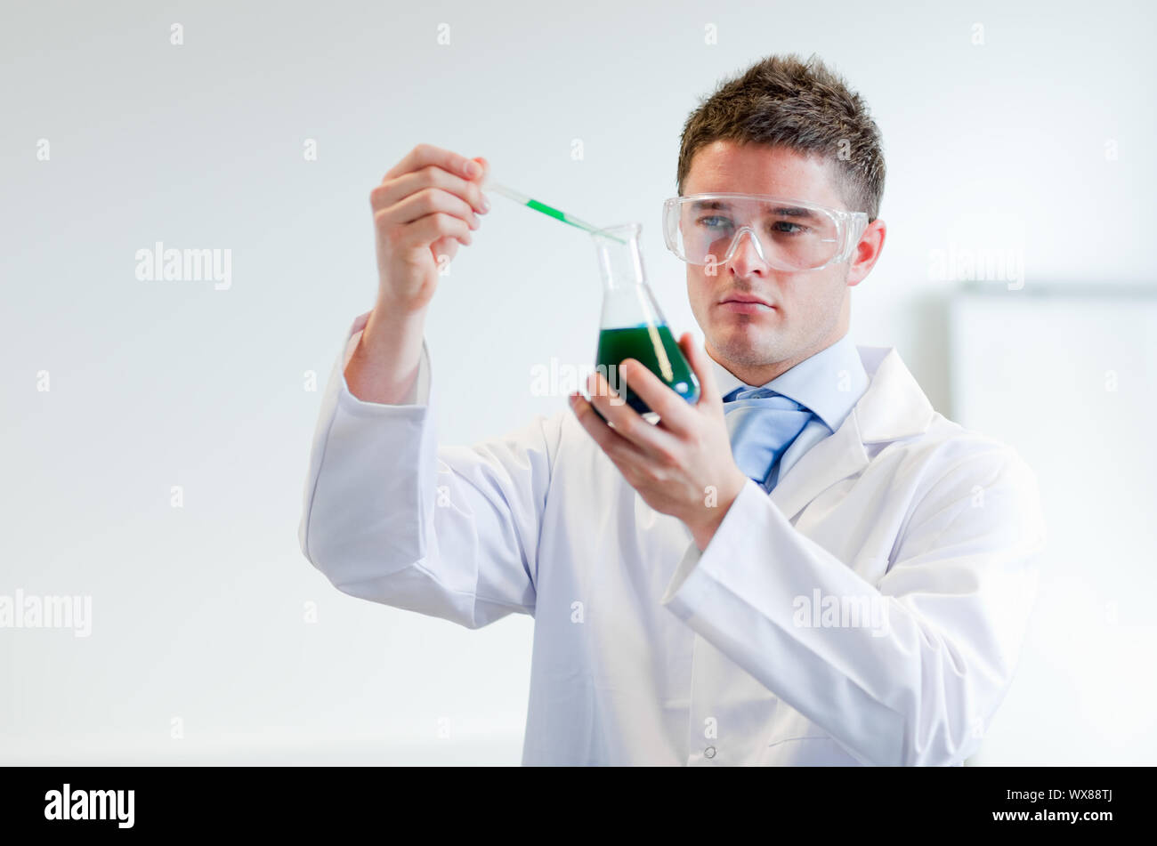 Nice doctor making an experience Stock Photo - Alamy