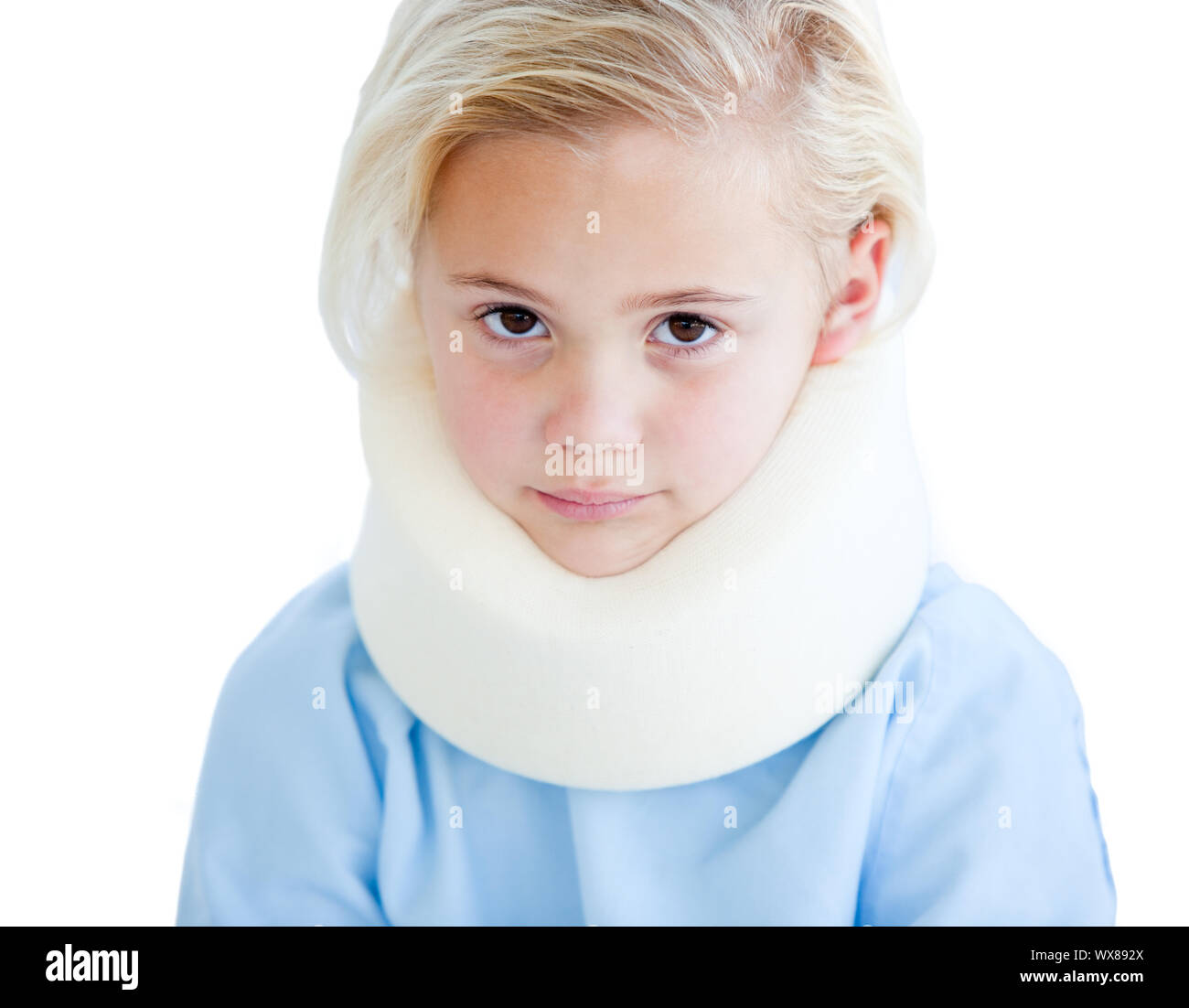 Portrait of a little girl with a neck brace against a white background ...