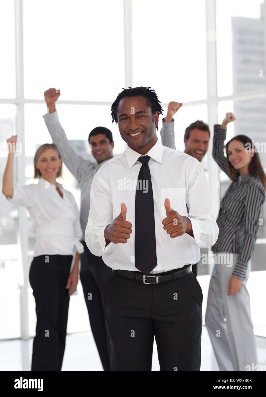 Portrait of an male leader with his team Stock Photo - Alamy