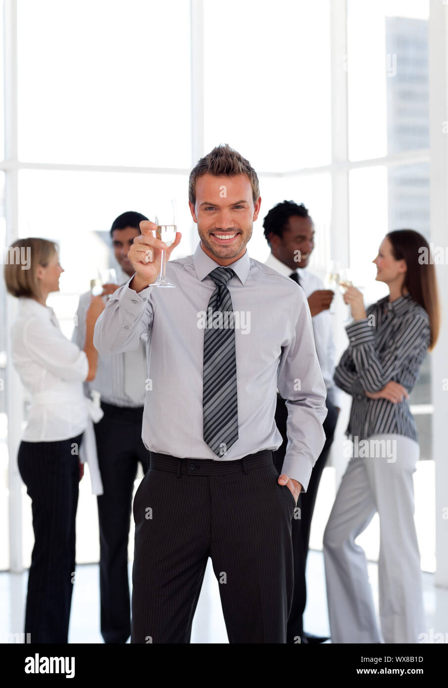 Portrait of a smiling male leader with his team Stock Photo - Alamy