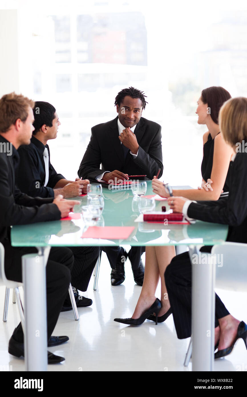 International business team interacting in a meeting Stock Photo - Alamy