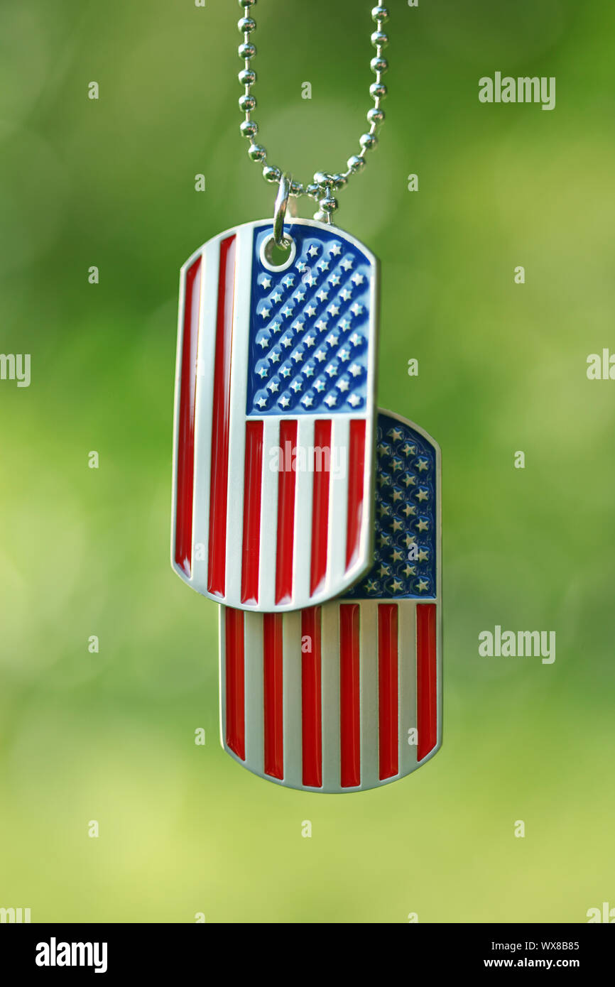 American flag dog tags hanging outside Stock Photo - Alamy