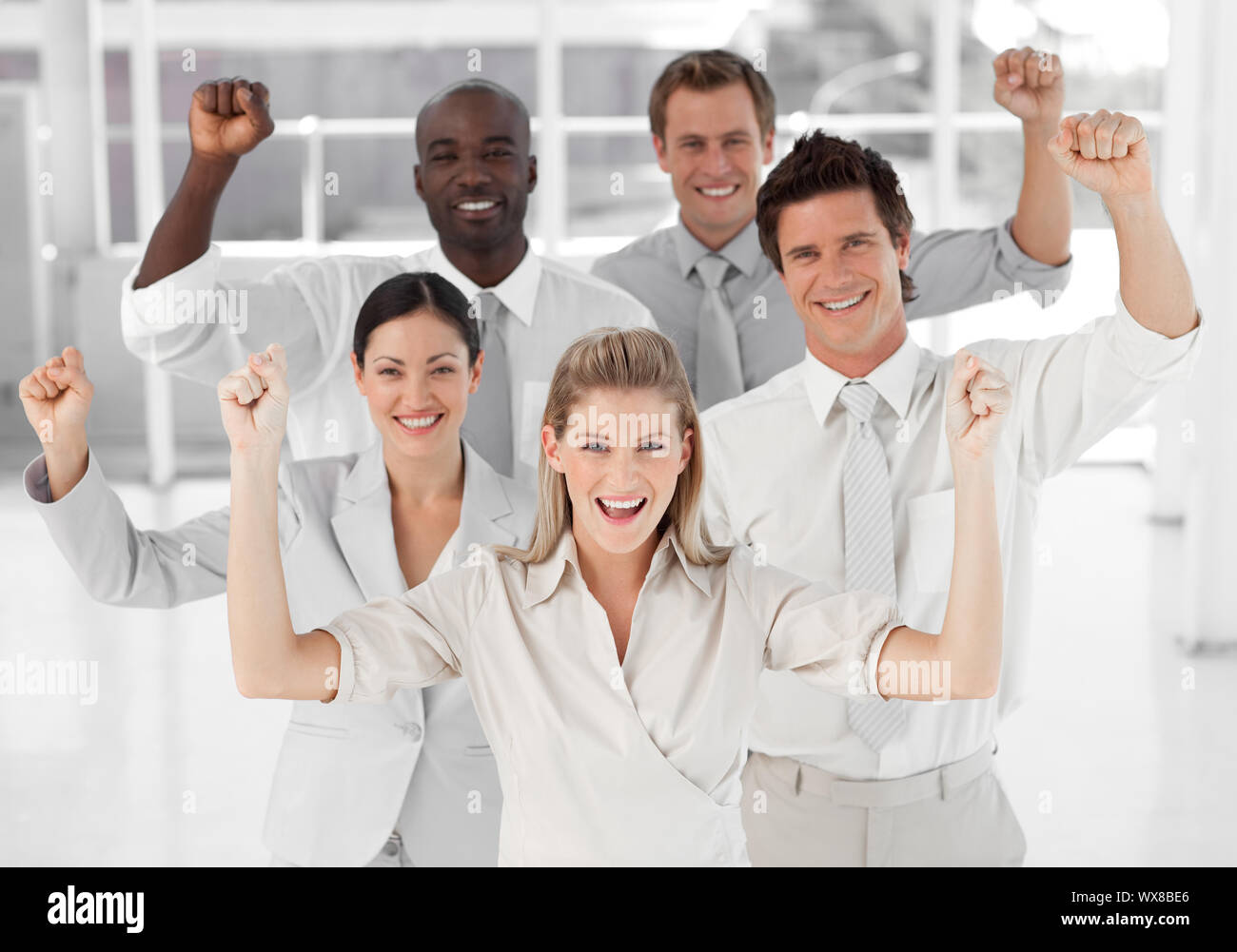 Positive Business Team Smiling and Holding up Thumbs to camera Stock ...