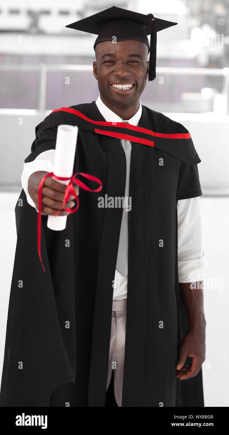 Man smilling at university graduation celebration Stock Photo - Alamy