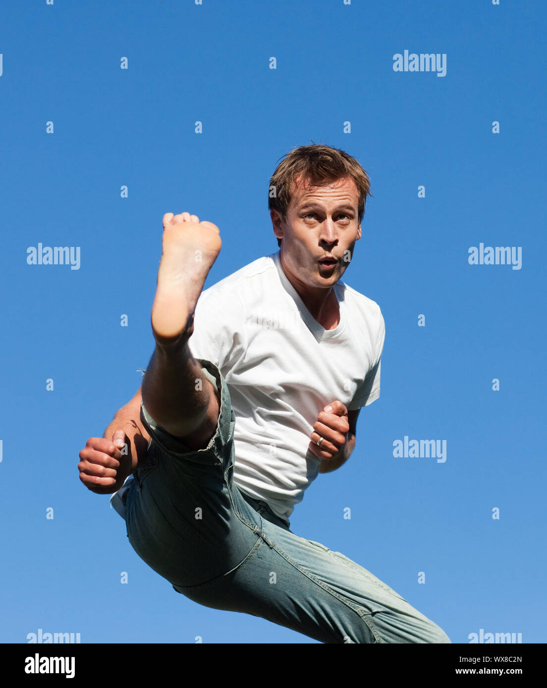 Man doing karate kick hi-res stock photography and images - Alamy