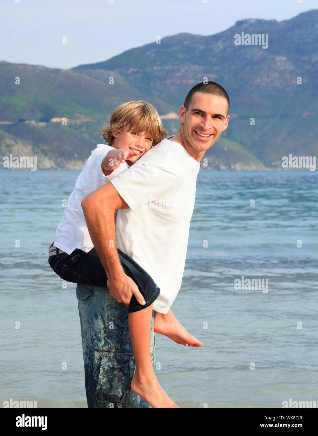 Piggy back male female laughing hugging hi-res stock photography and ...