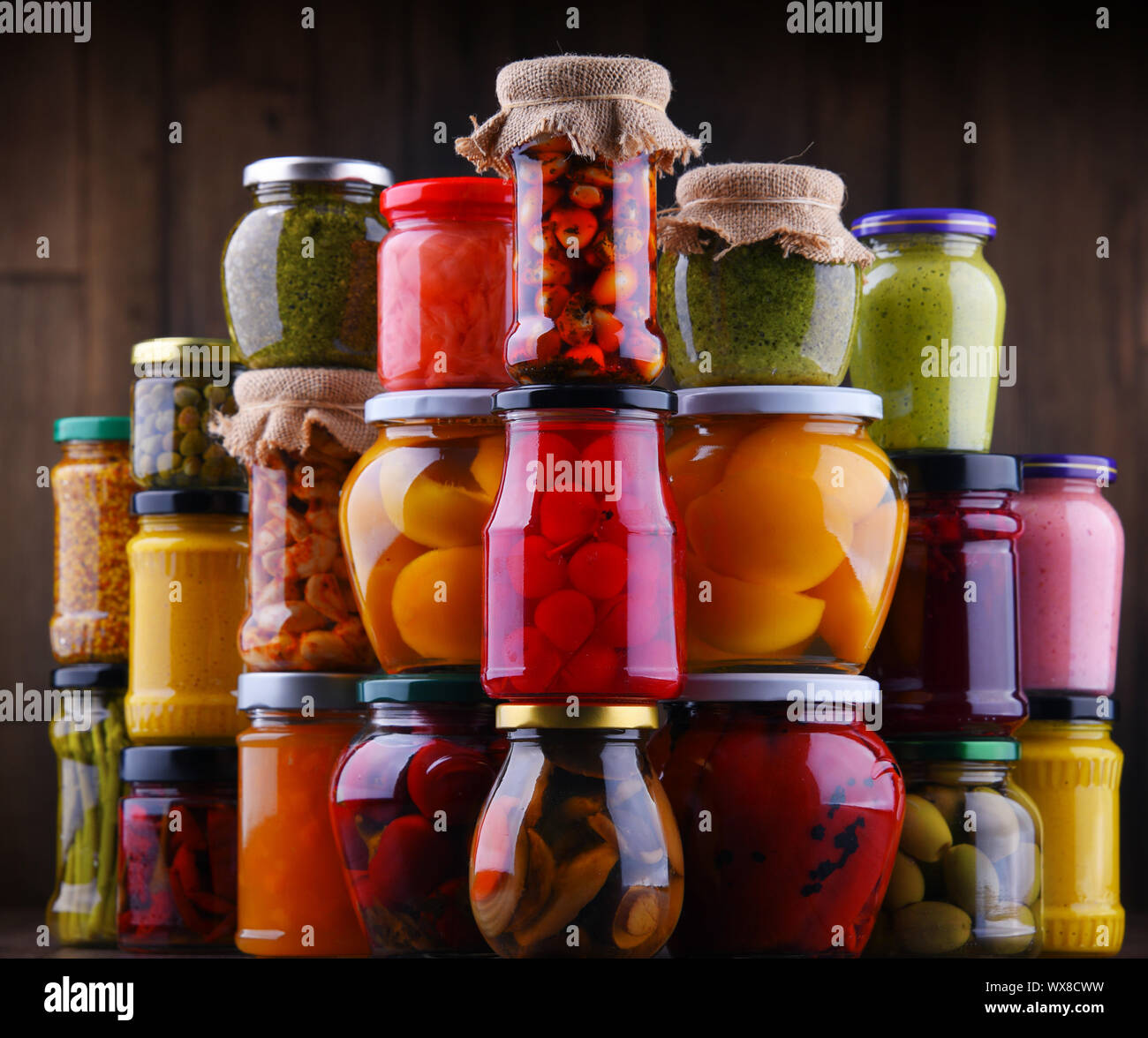Jars with variety of pickled vegetables and fruits. Preserved food ...