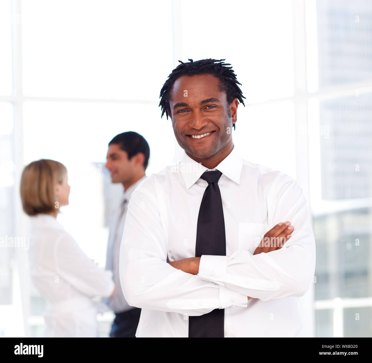 Young businessteam folded arms hi-res stock photography and images - Alamy