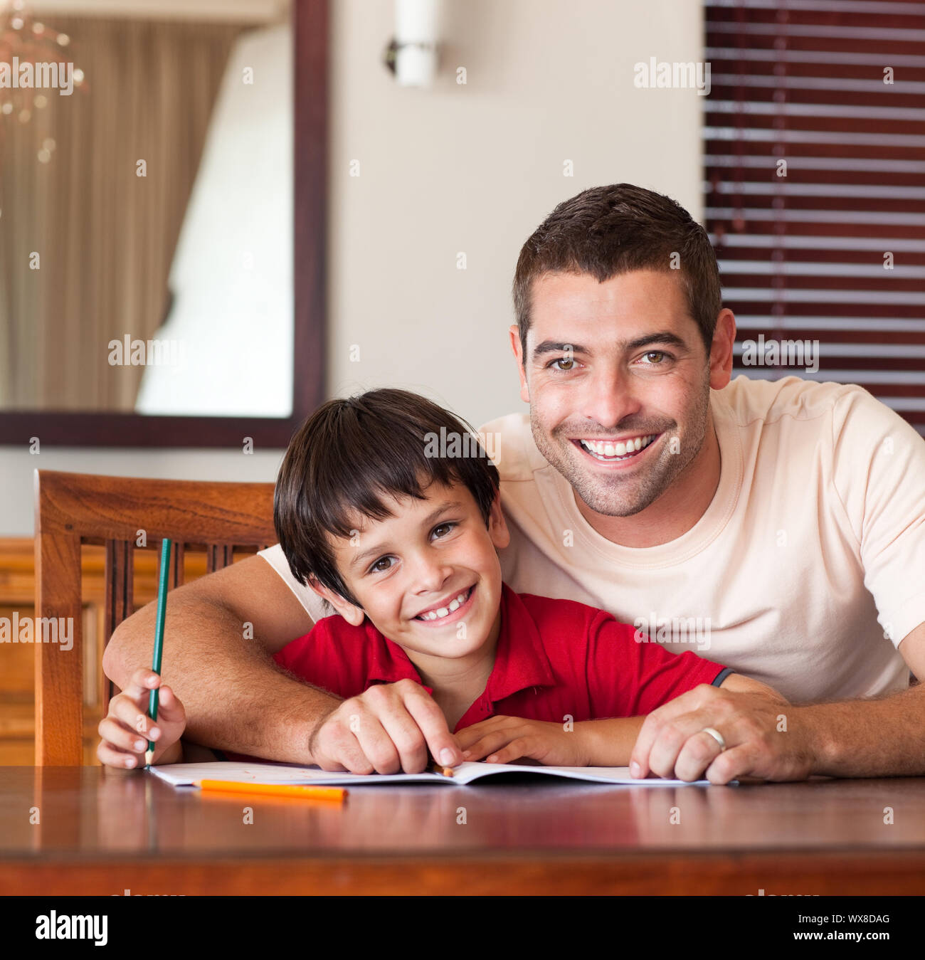 Mother helping boy read hi-res stock photography and images - Alamy