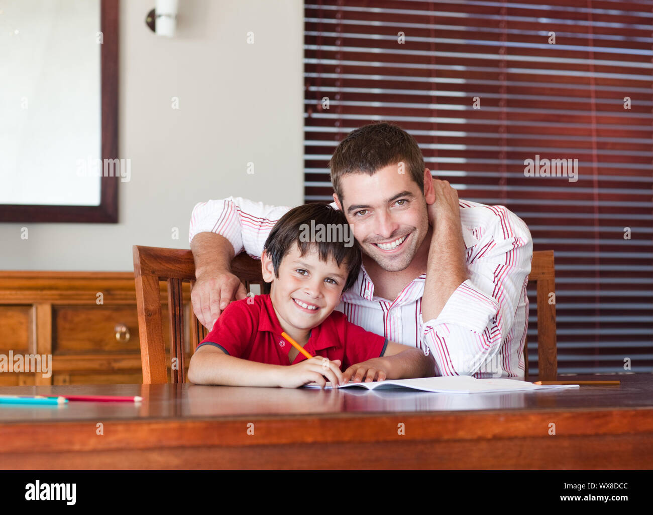 Father helping son school work hi-res stock photography and images - Alamy