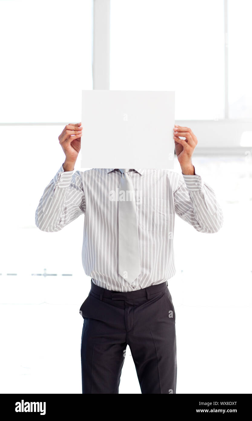 Businessman presenting a big white card in front of his face Stock ...