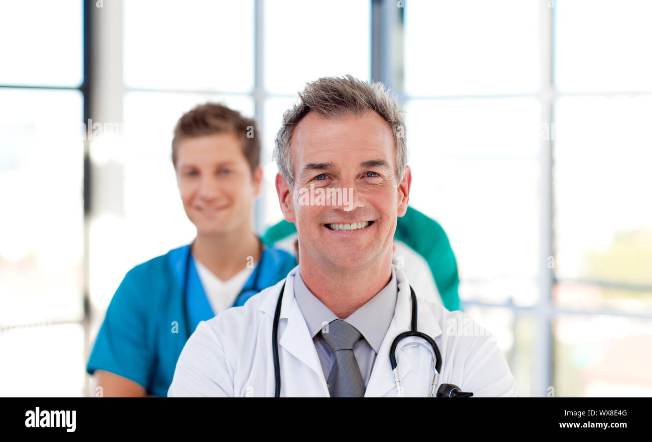 Senior doctor leading his team in hospital Stock Photo - Alamy