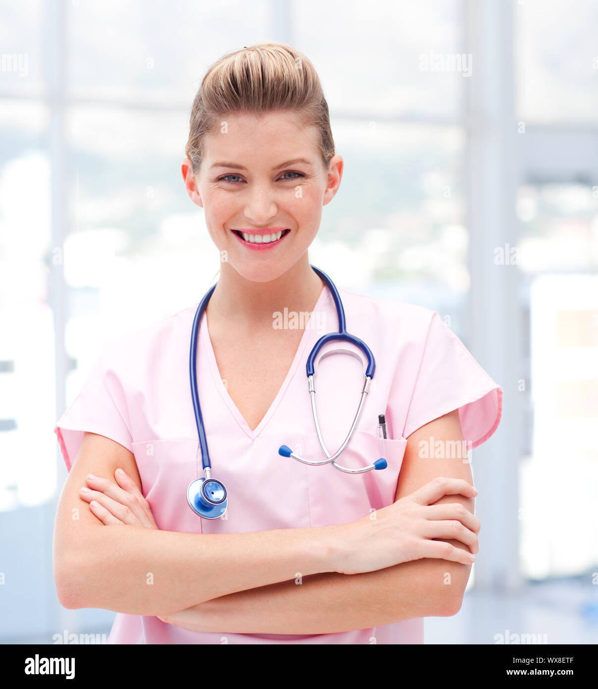 Cute female doctor looking at the camera Stock Photo - Alamy