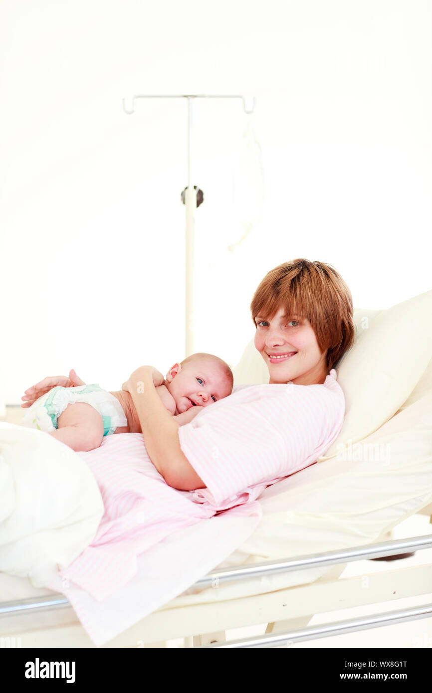 Patient with newborn baby in bed in hospital with copy-space Stock ...