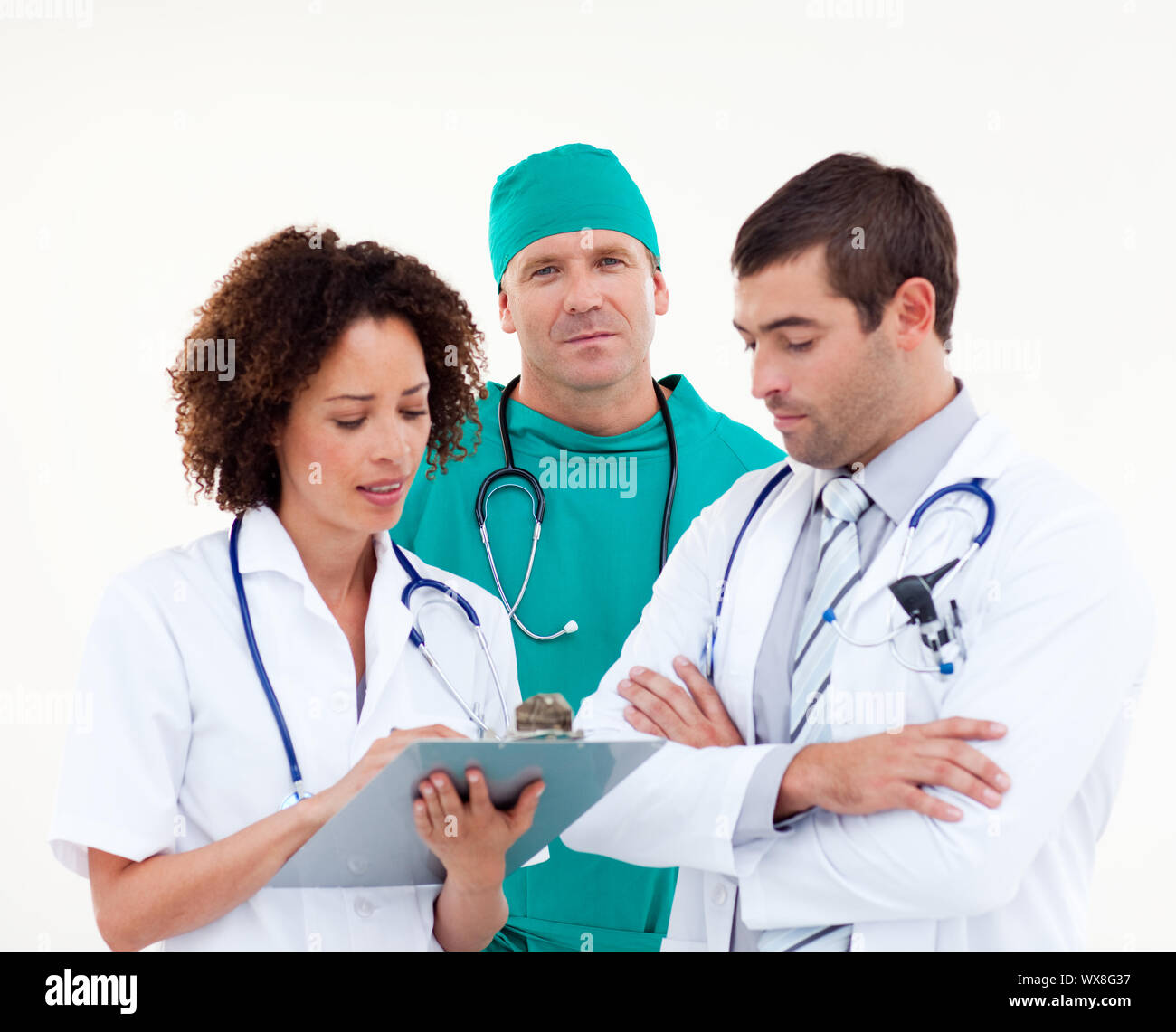 Positive doctors looking at the camera Stock Photo - Alamy