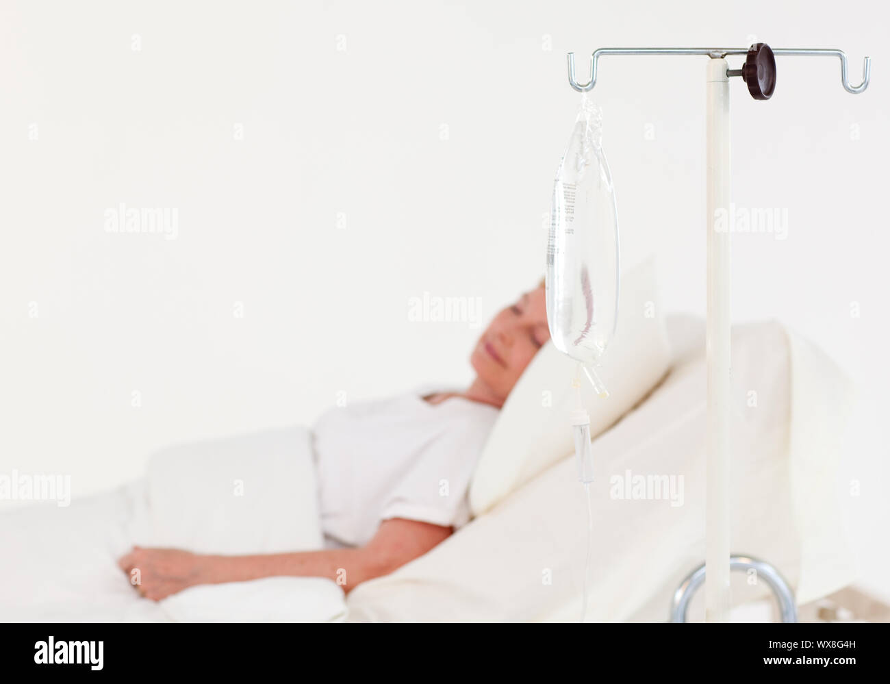 Relaxed patient lying on a medical bed Stock Photo - Alamy