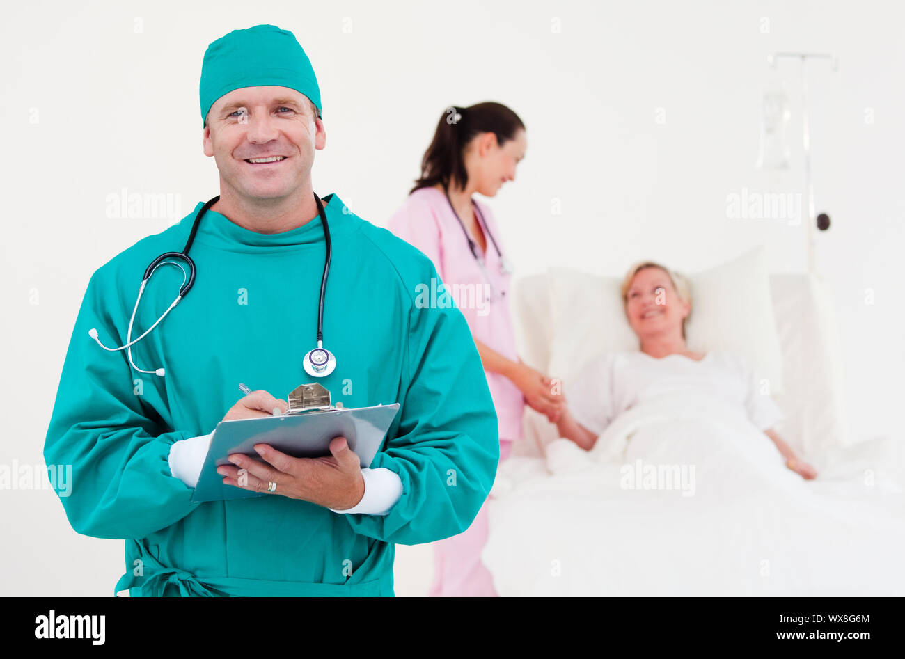 Doctors examining a patient together Stock Photo - Alamy