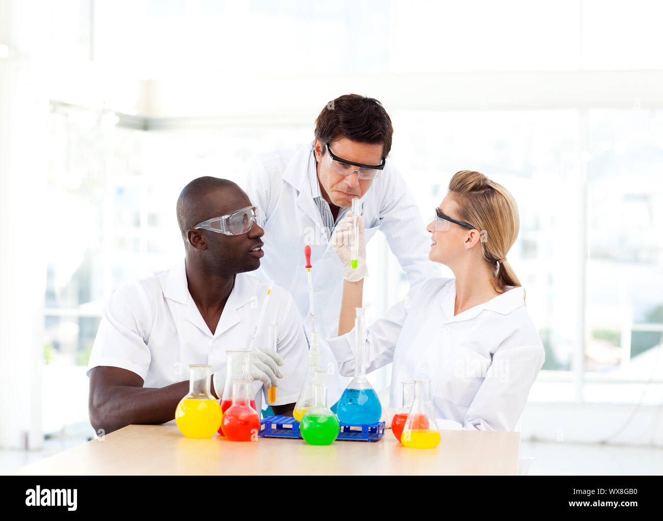 Scientists making experiments in a laboratory Stock Photo - Alamy
