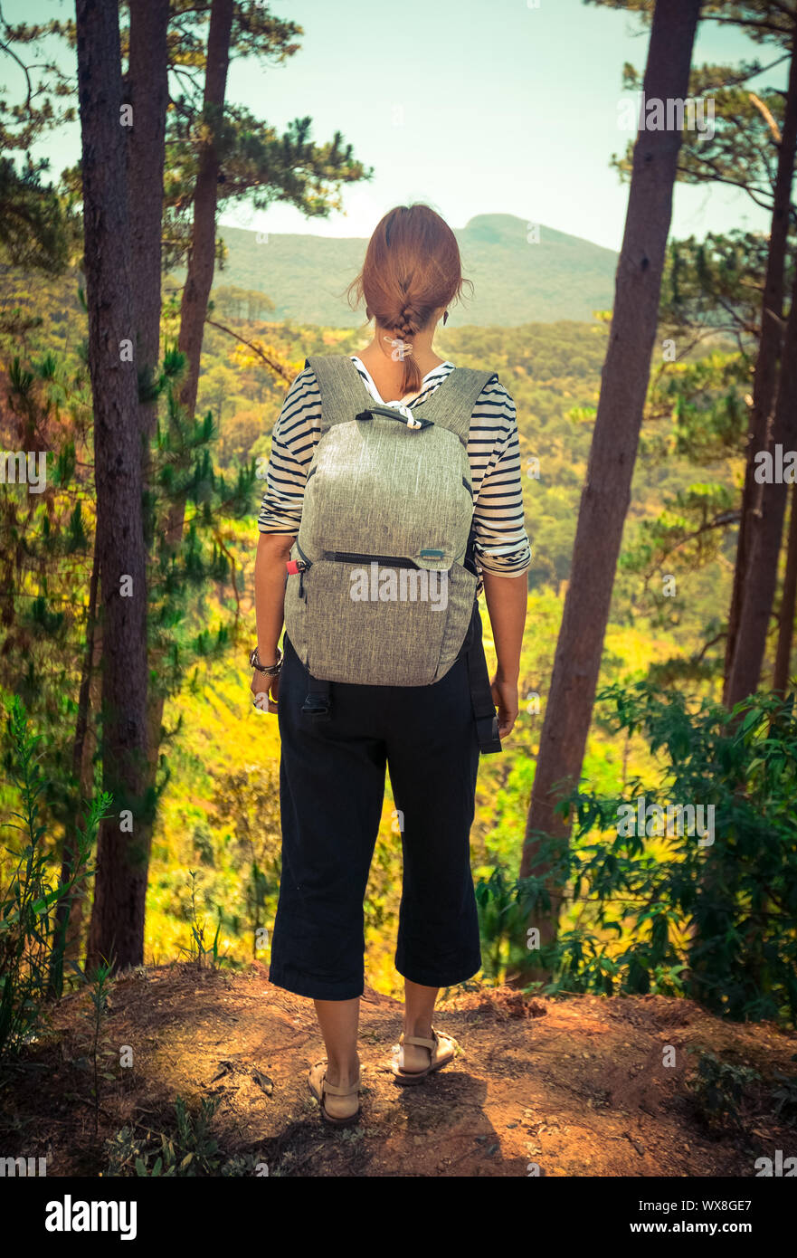 Tourist with backpack in highland Stock Photo - Alamy
