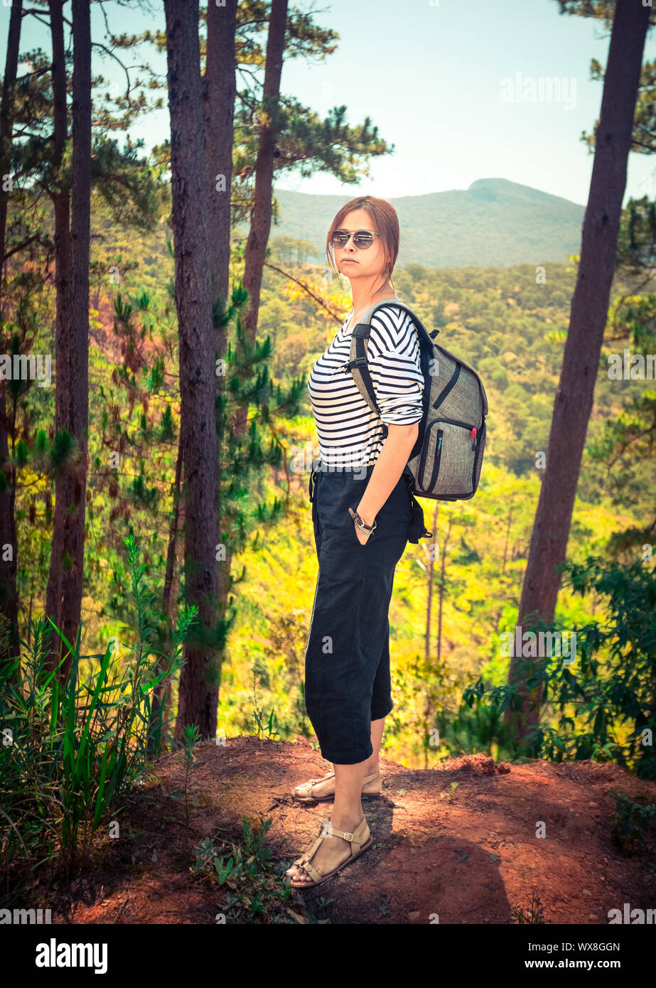 Tourist with backpack in highland Stock Photo - Alamy
