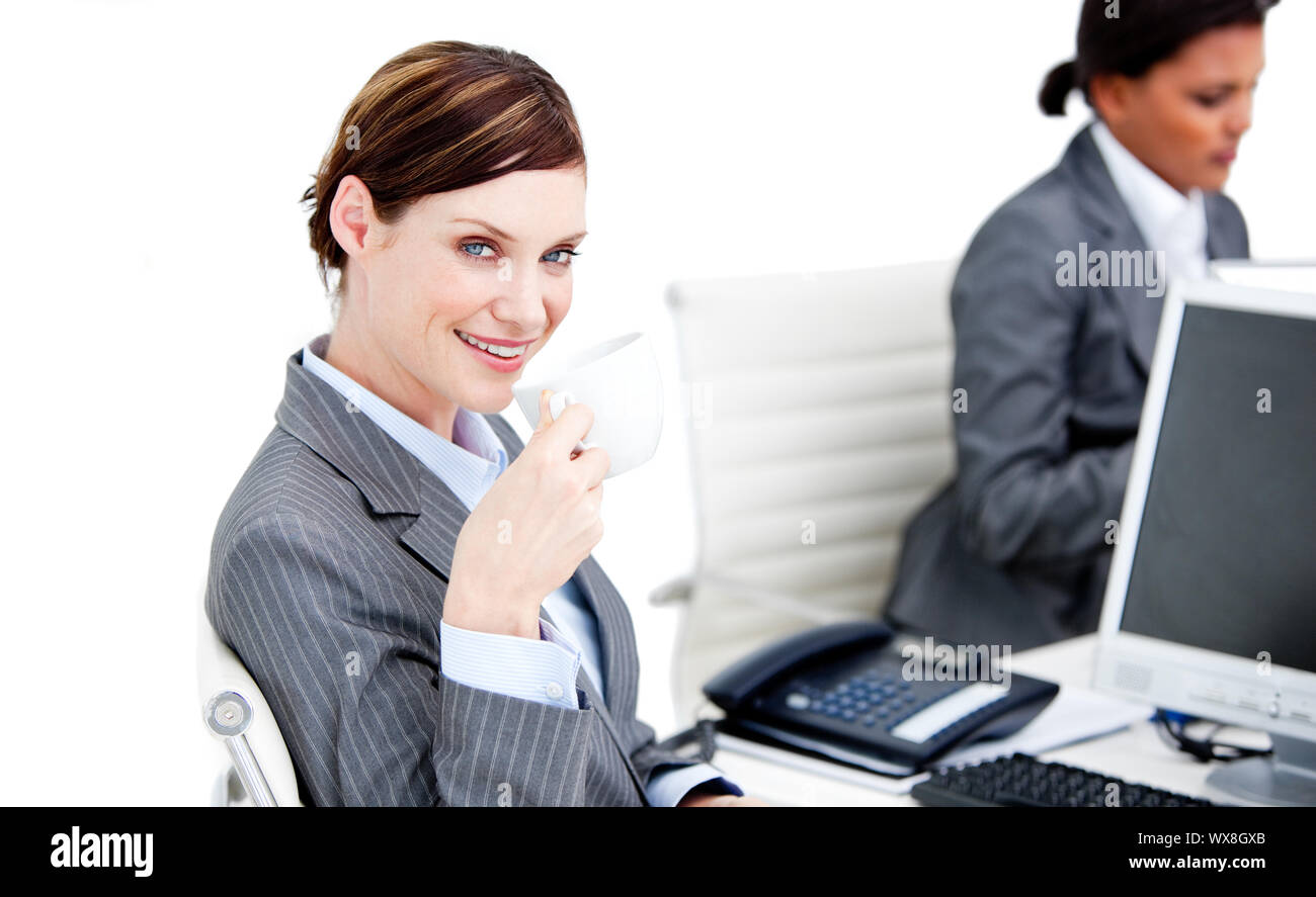 Relaxed businesswoman partners having a break drinking coffee in the ...
