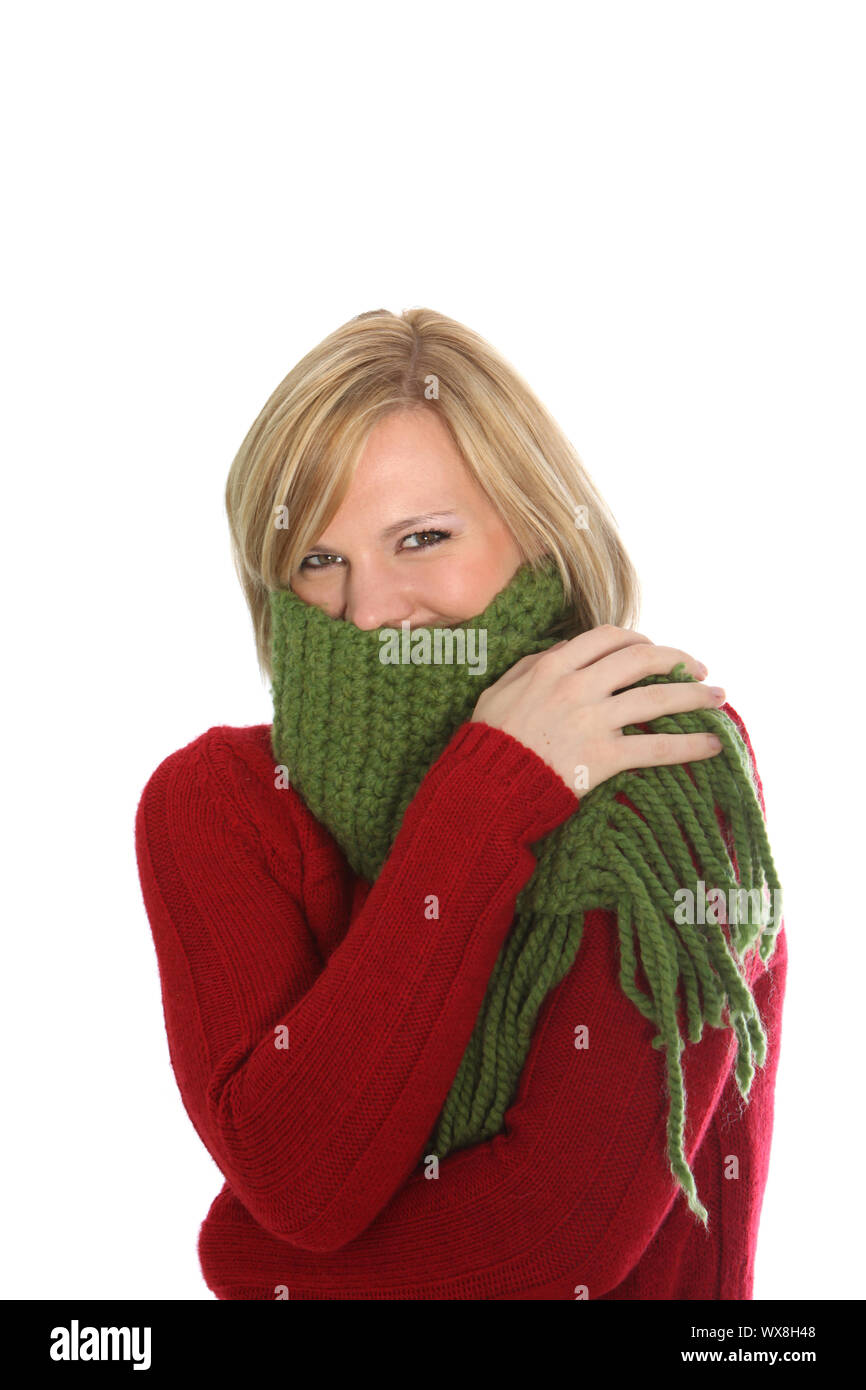 Woman shivering in the winter cold hugging herself around the chest and ...