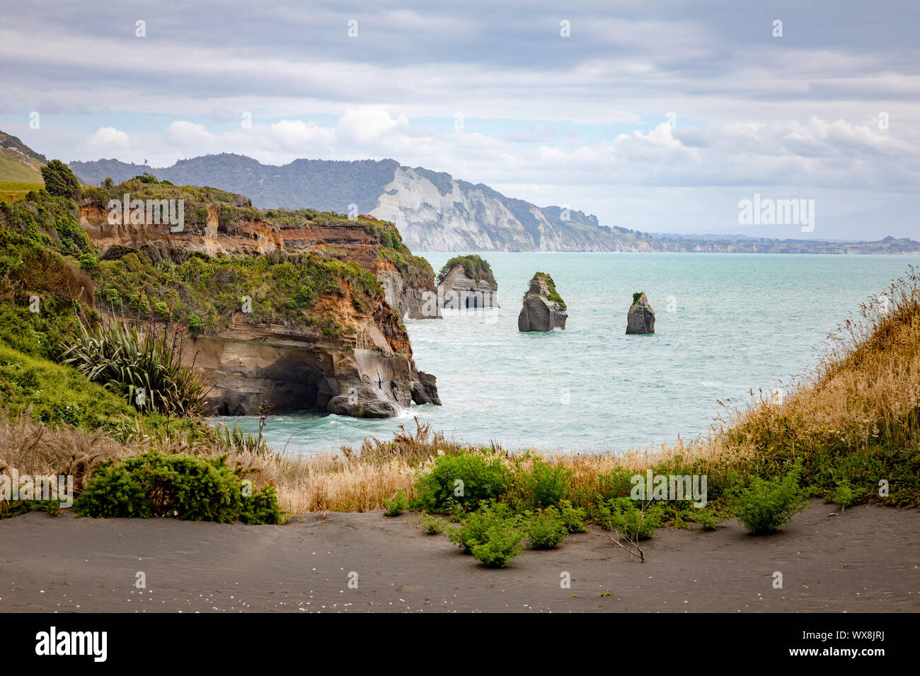 sea shore rocks and mount Taranaki, New Zealand Stock Photo - Alamy