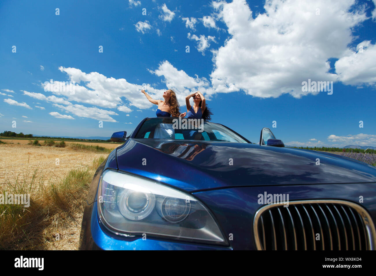 women dance in car Stock Photo - Alamy