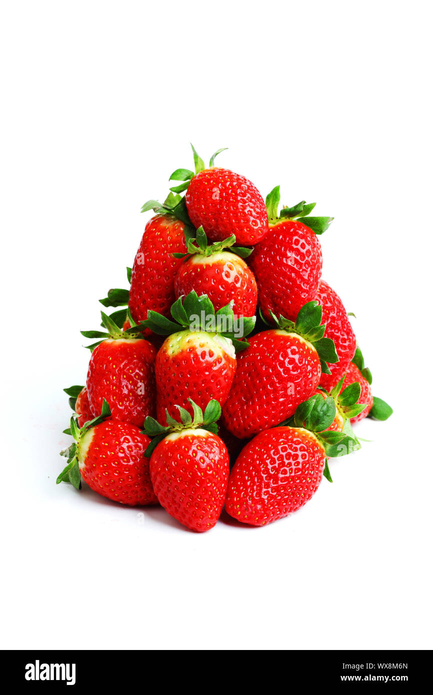 strawberry pile isolated on white background Stock Photo - Alamy