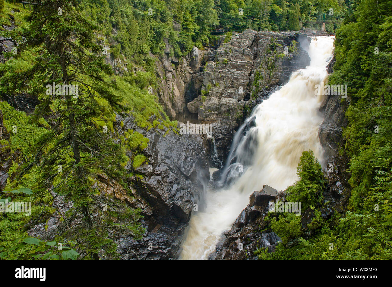 a big waterfall falling down to a canyon Stock Photo - Alamy
