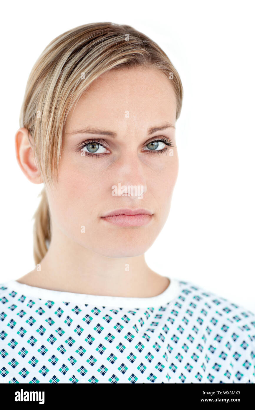 Portrait of an unhappy patient against white background Stock Photo - Alamy