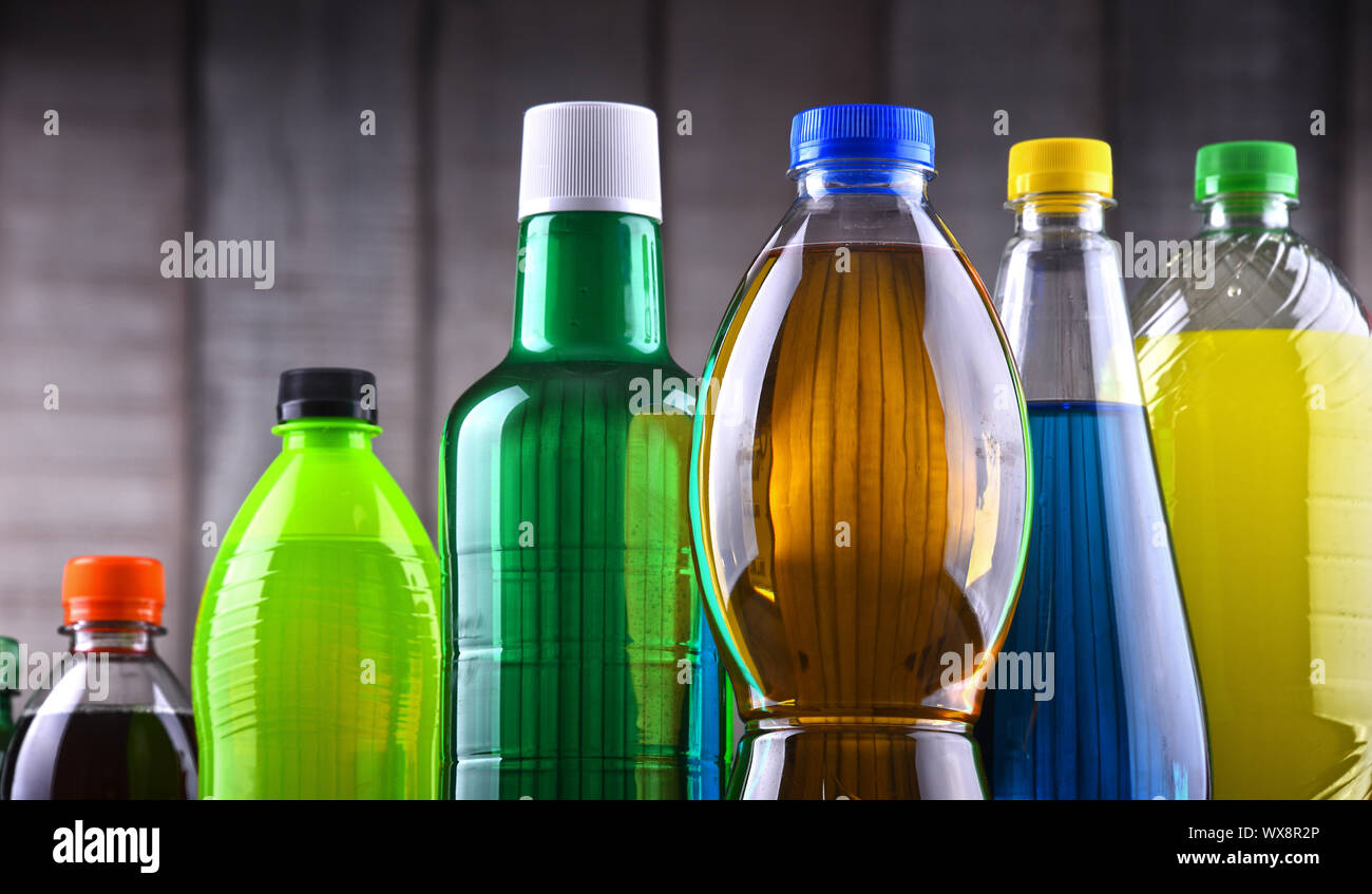 Plastic bottles of assorted carbonated soft drinks in variety of colors ...
