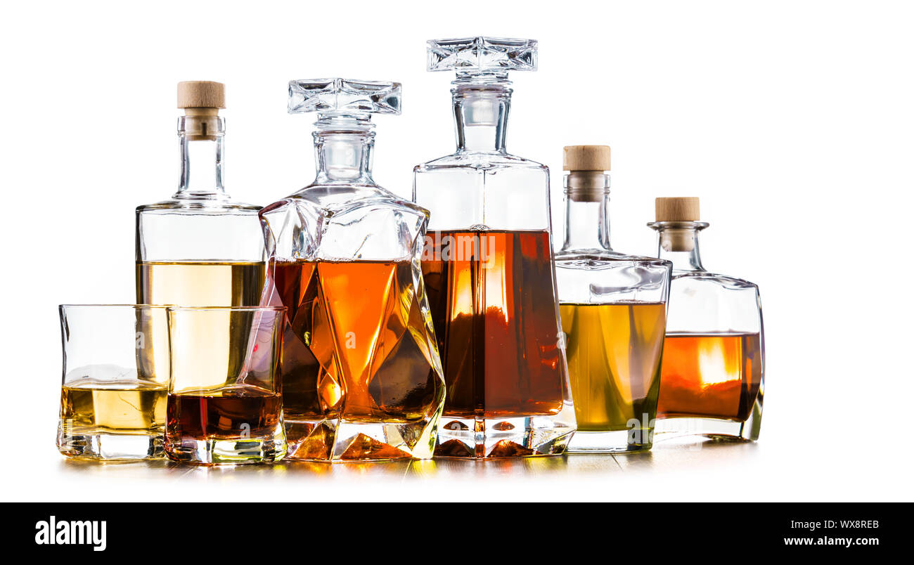 Composition with carafe and bottles of assorted alcoholic beverages ...