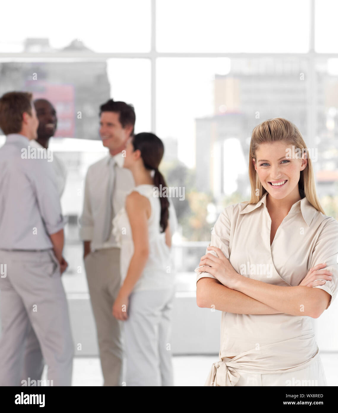 Charming people talking together at work in a office Stock Photo - Alamy