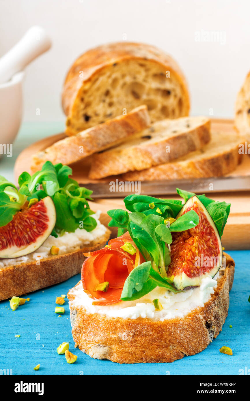 Toast from swiss twisted bread, with feta cheese or ricotta, fresh figs ...