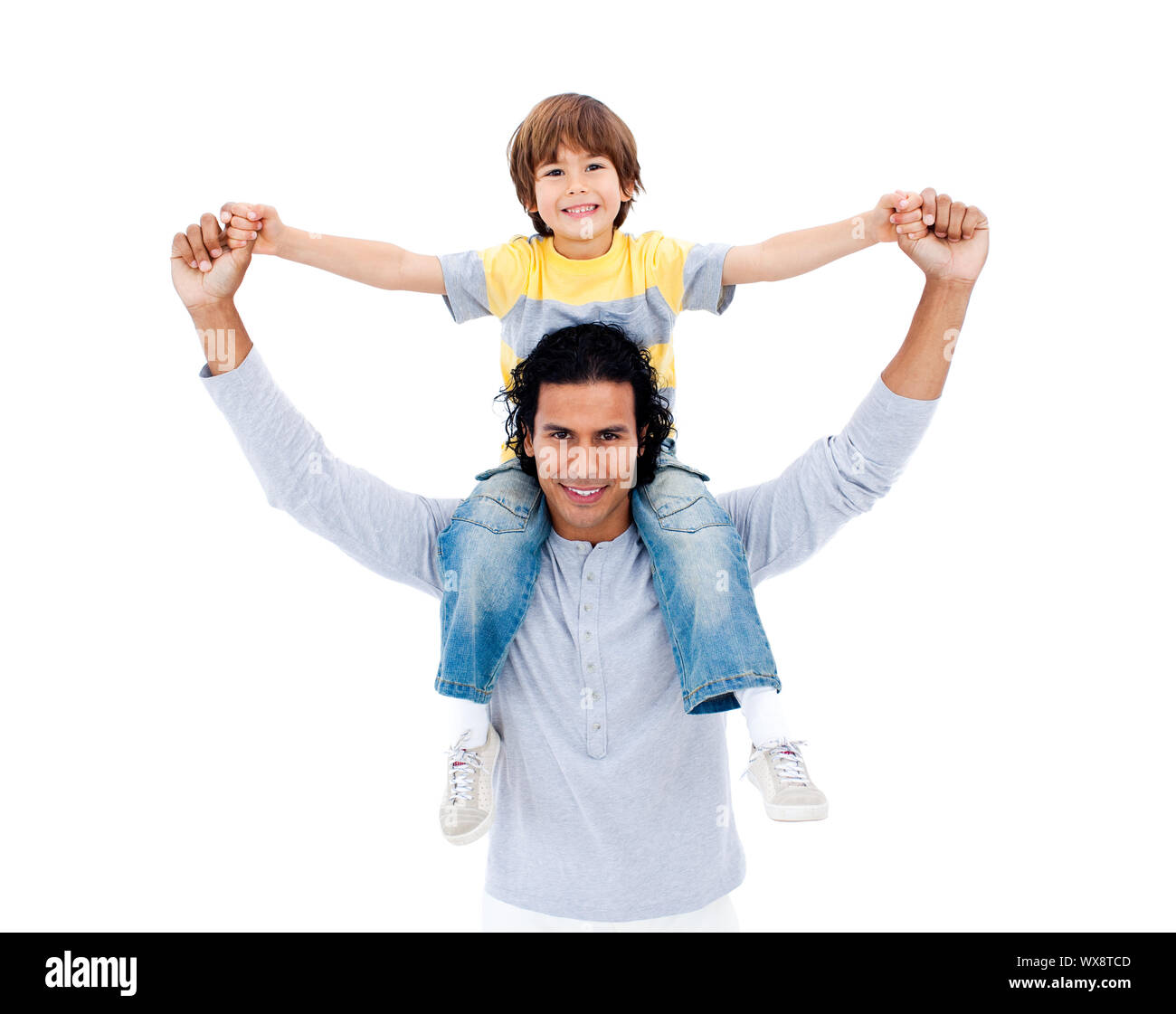 Attentive father playing with his son against a white background Stock ...