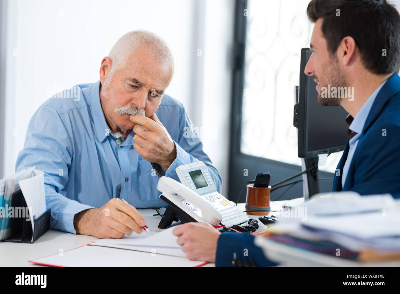 Junior employees hi-res stock photography and images - Alamy
