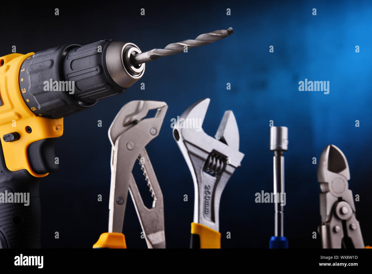 Composition with hardware tools including cordless drill and monkey ...