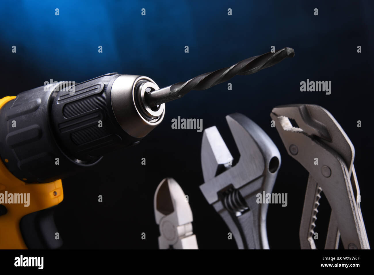 Composition with hardware tools including cordless drill and monkey ...