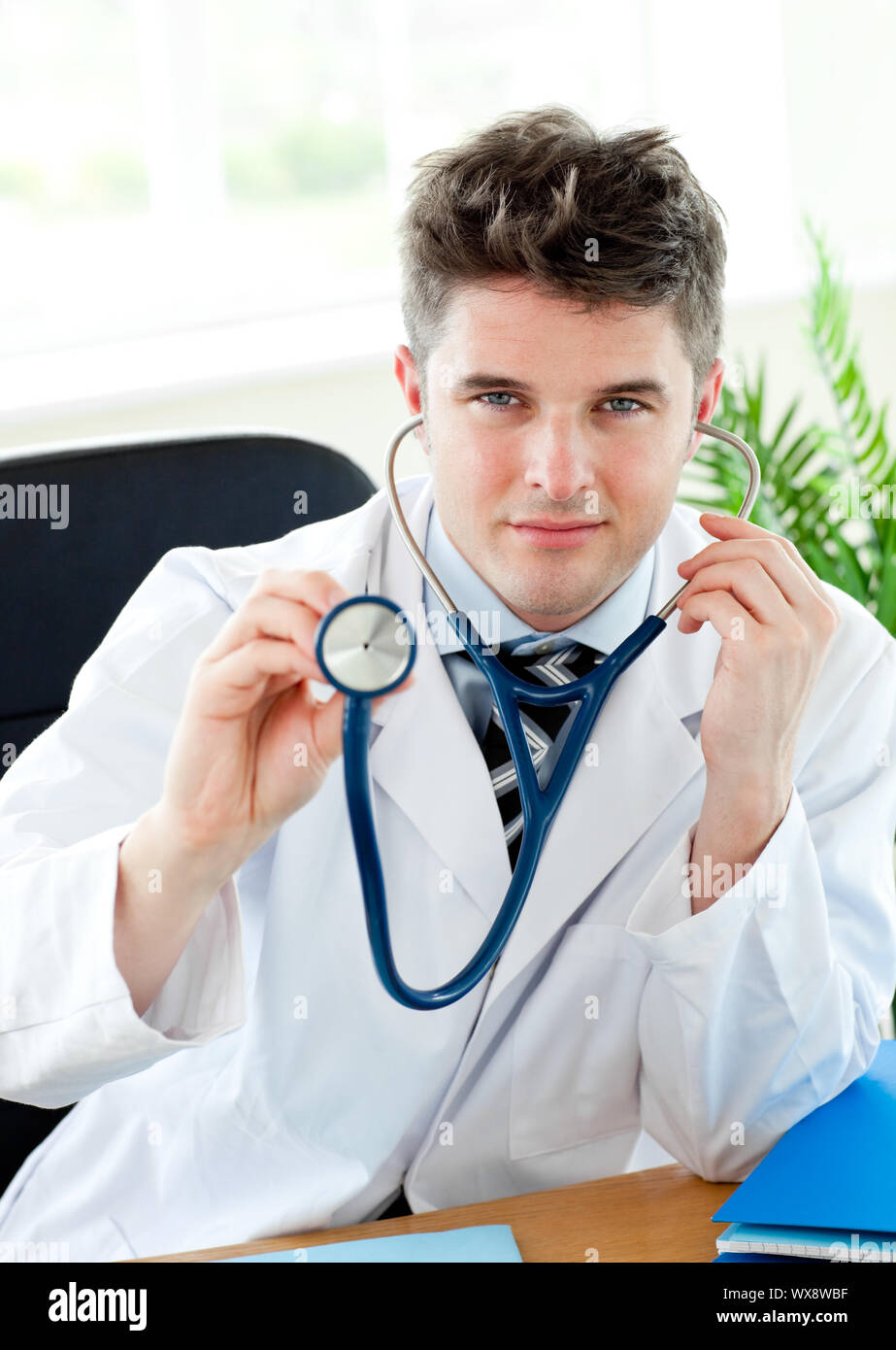 Smiling doctor with a stethoscope isolated Stock Photo - Alamy