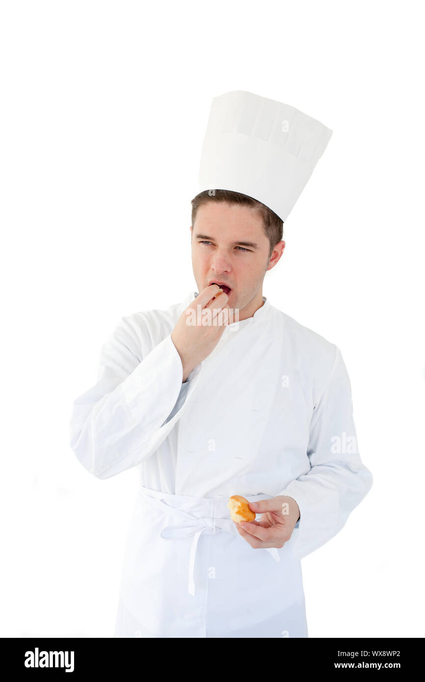 Cook eating something against white background Stock Photo - Alamy