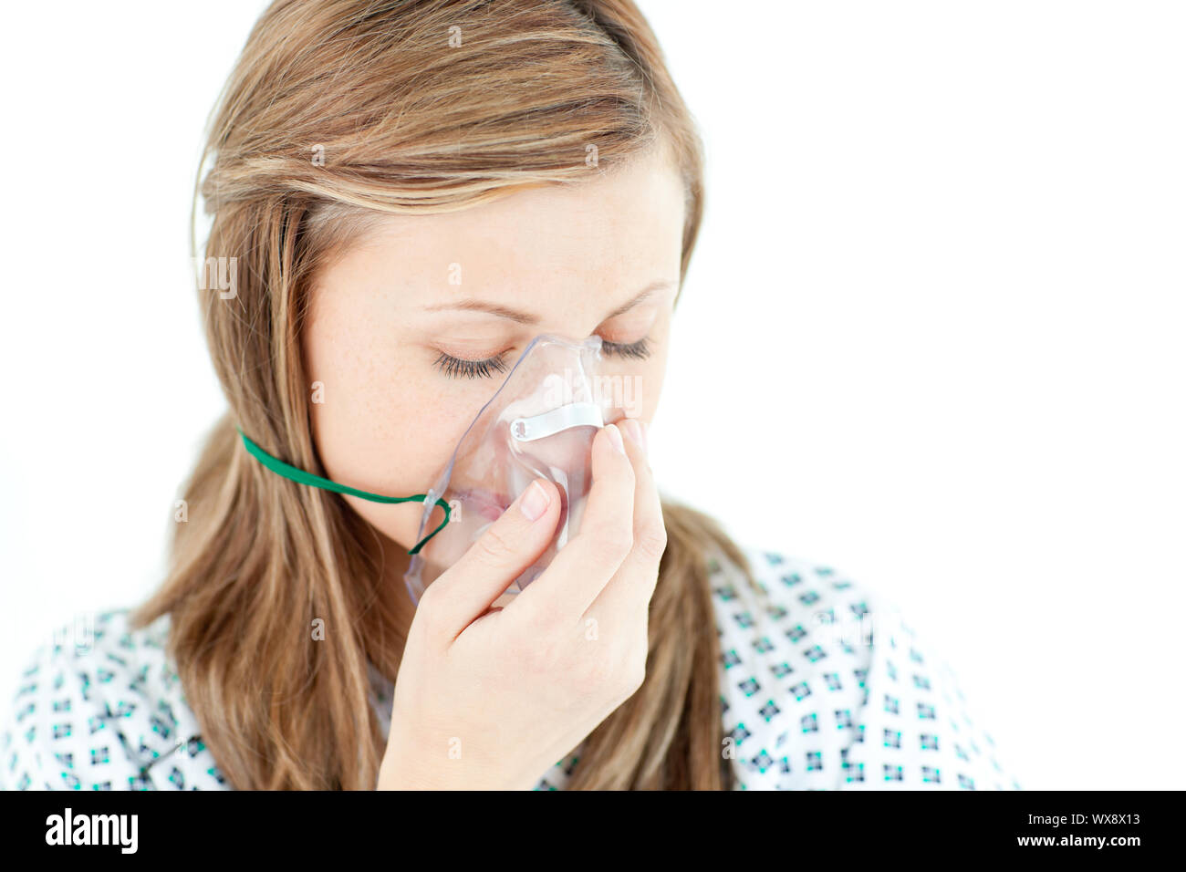 Depressed female patient with a mask against white background Stock ...