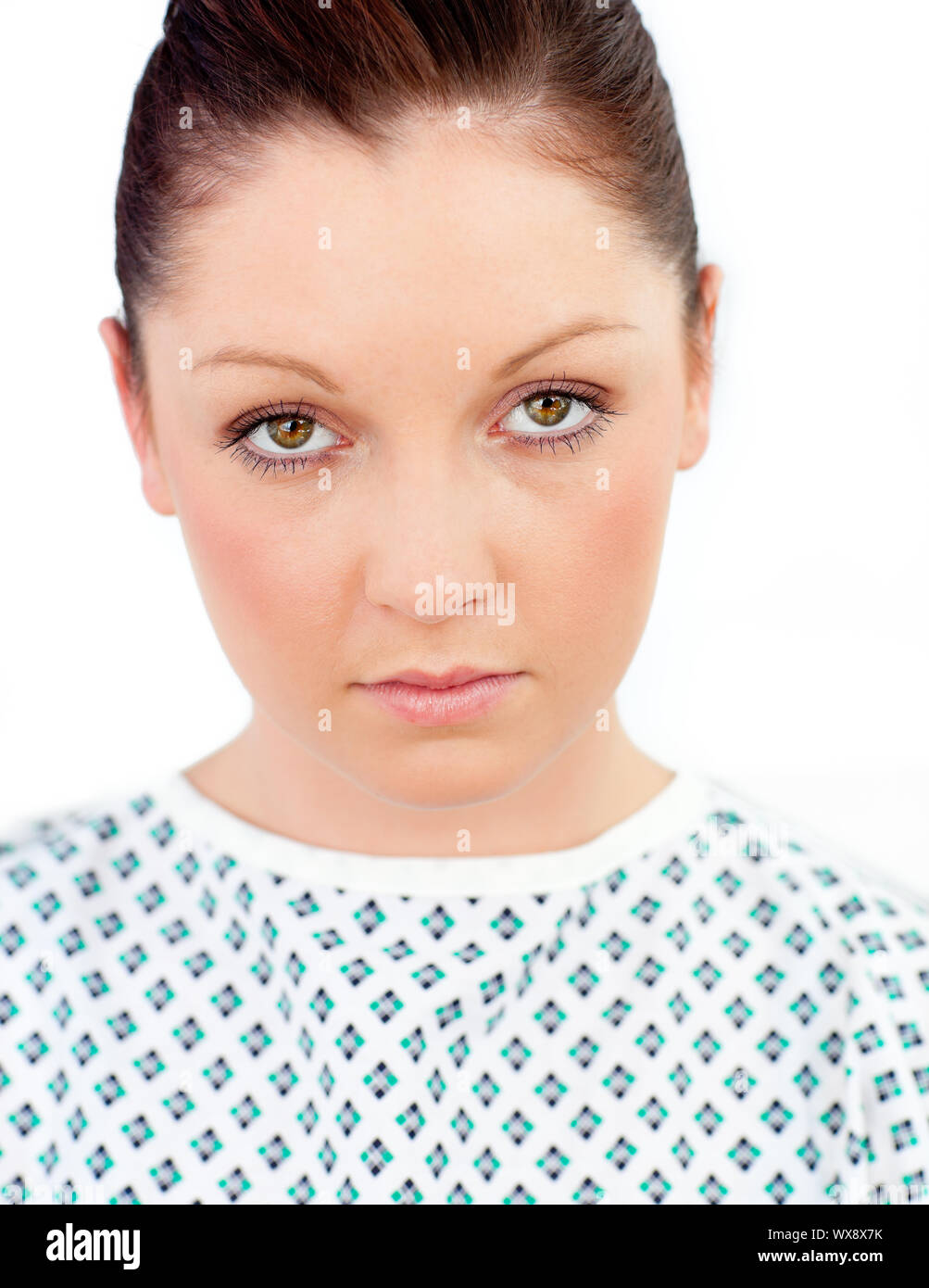 Sick female patient looking at the camera against white background ...