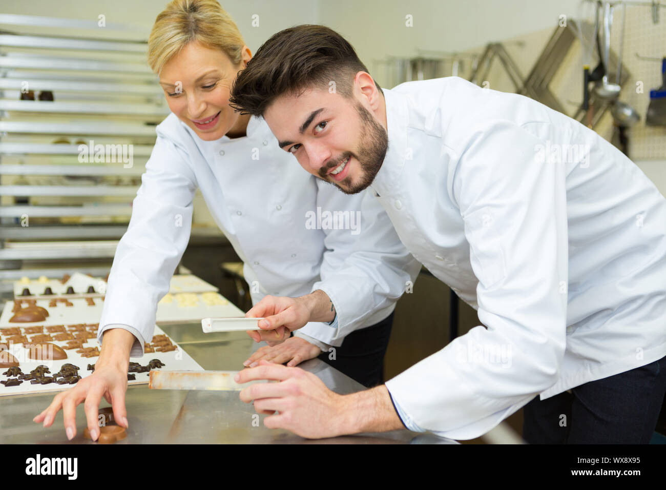 woman and man professional pastry cook at work Stock Photo - Alamy