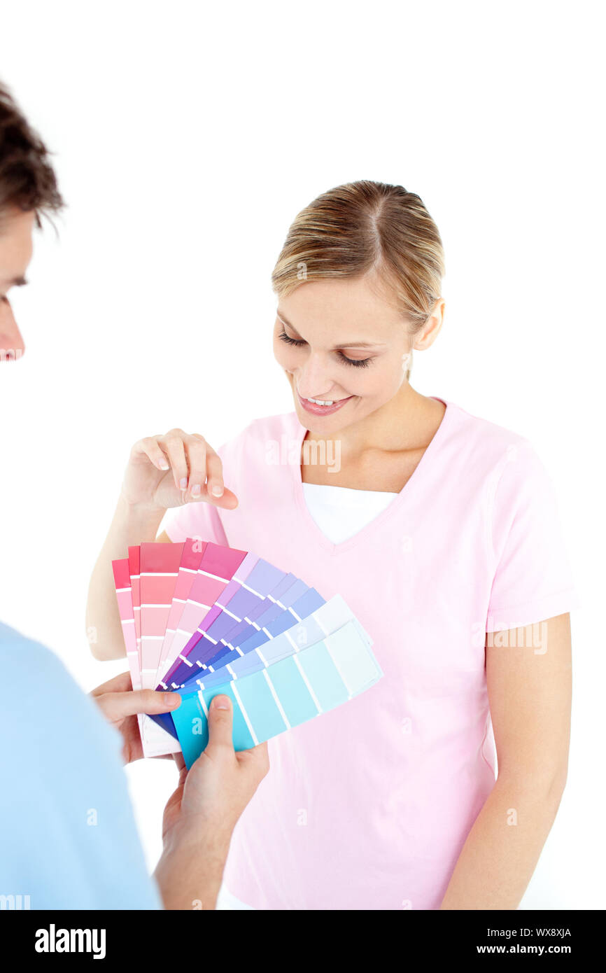 Happy young woman choosing colors for painting a room at home Stock ...
