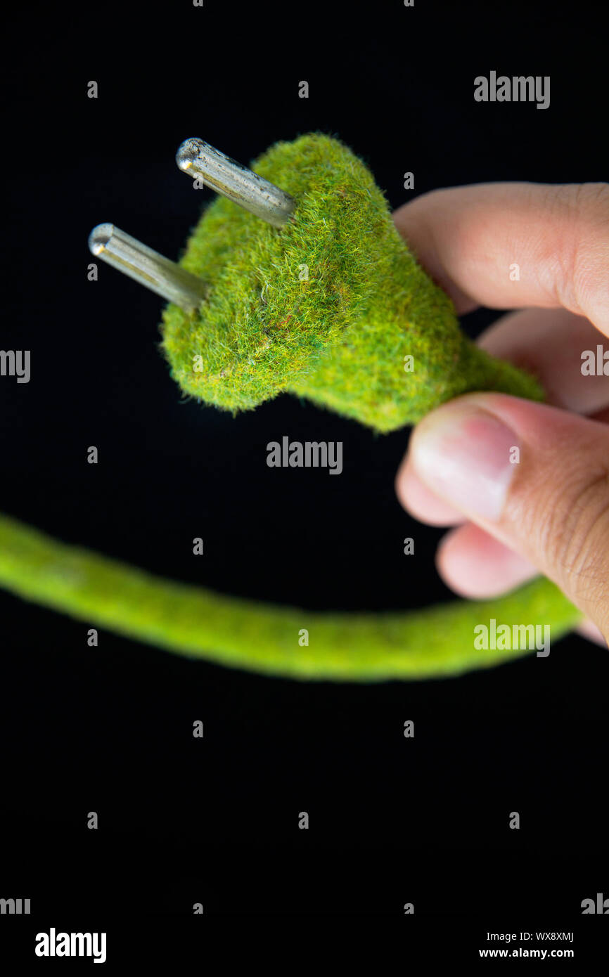 green electric plug concept Stock Photo - Alamy